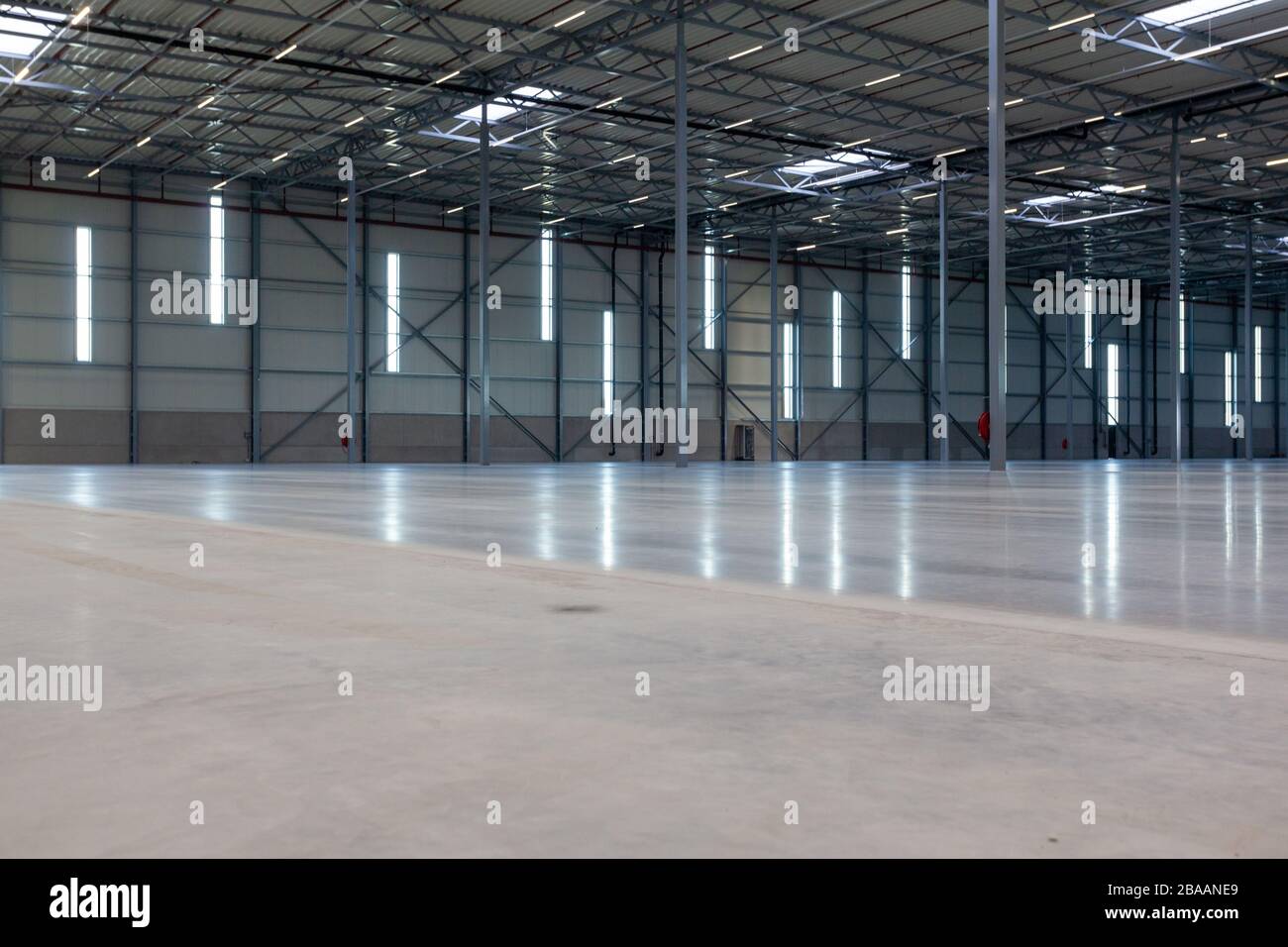 Inside of a big warehouse with windows Stock Photo - Alamy