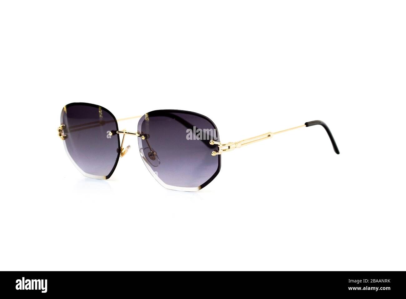 Black gradient rimless sunglasses with gold frame isolated on white ...