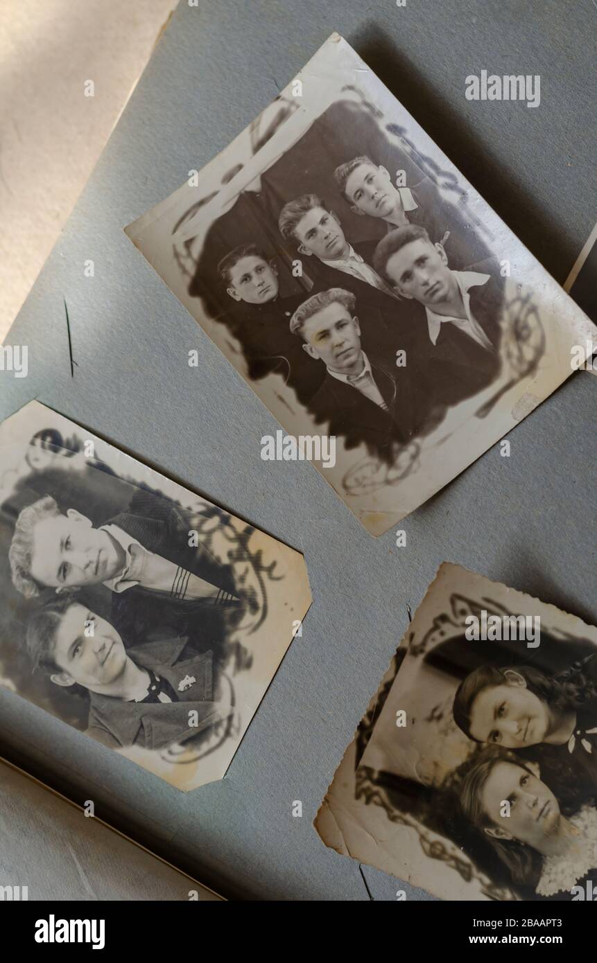 Antique photos in the family photo album. Old photos of relatives ...