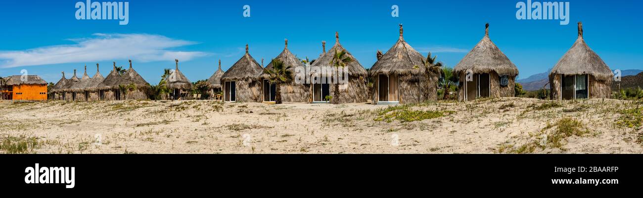 View of thatched huts on beach, Todos Santos, Baja California Sur ...