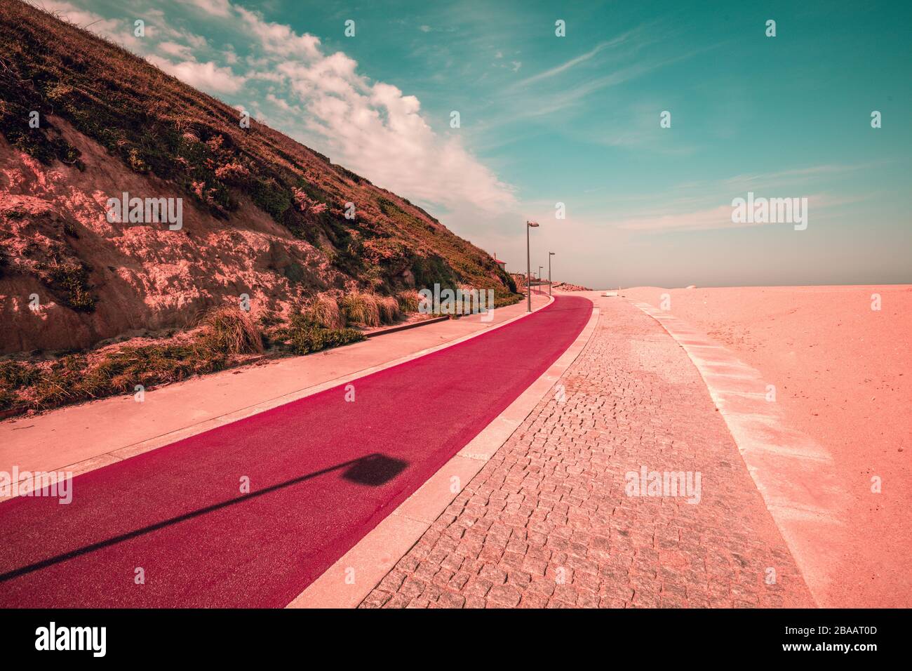 Red promenade on the beach in spring. Beautiful bay on a sunny day ...