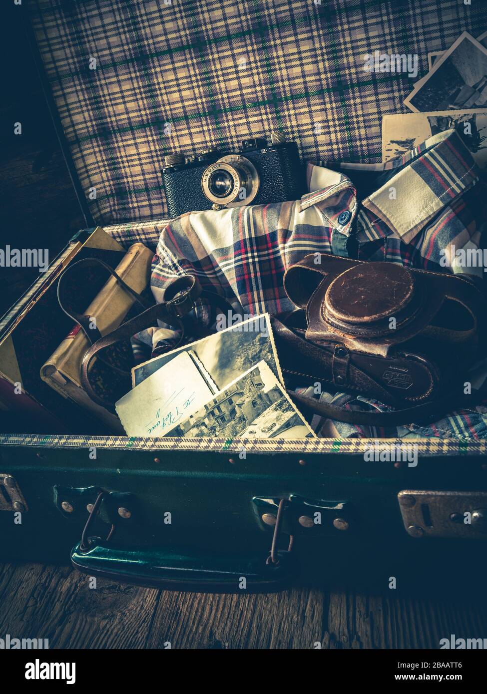 old suitcase with photos and memories Stock Photo - Alamy