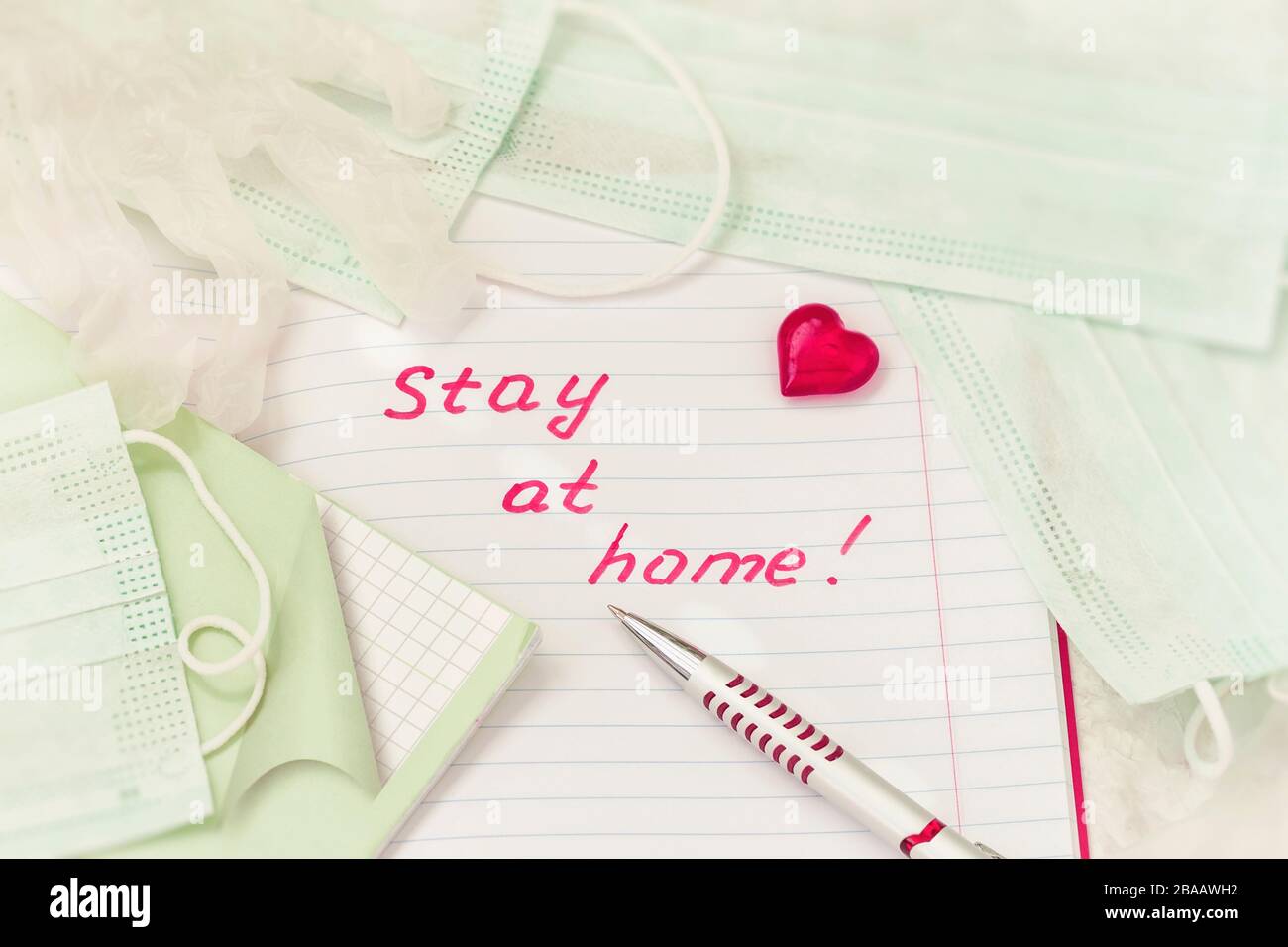 Stay at home Text in a school notebook. Call for self-isolation during ...