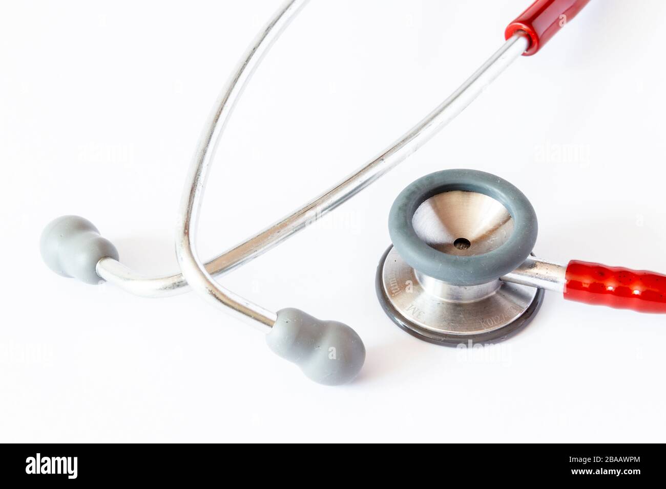 A red stethoscope isolated on a white background Stock Photo - Alamy