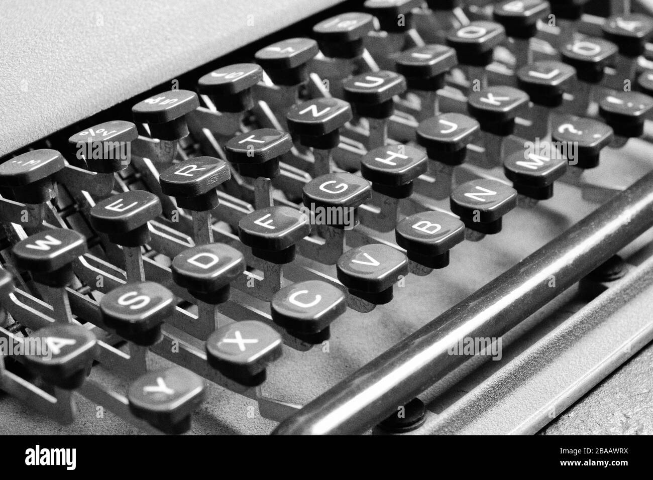 Keyboard of an old retro typewriter with the English alphabet.In black ...
