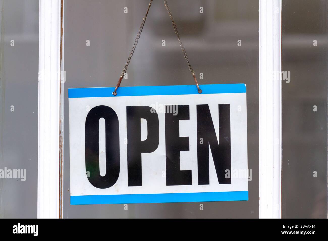 Open sign in a store window Stock Photo - Alamy