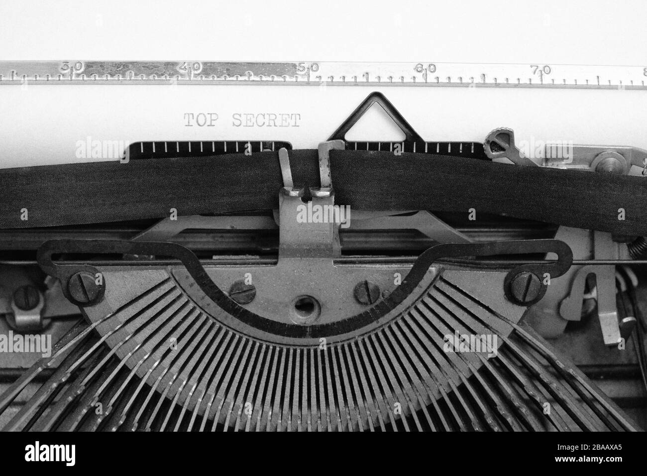 Old retro vintage typewriter. A white sheet with the printed text top ...