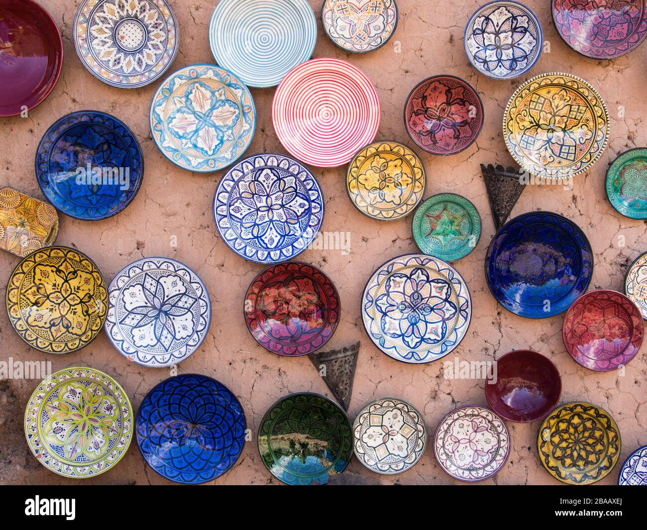 display of colourful plates on the wall Stock Photo - Alamy