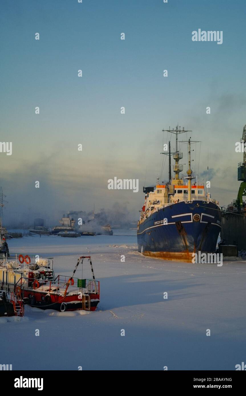 St. Petersburg, Russia - February 20, 2011: Ships and cranes in cargo ...