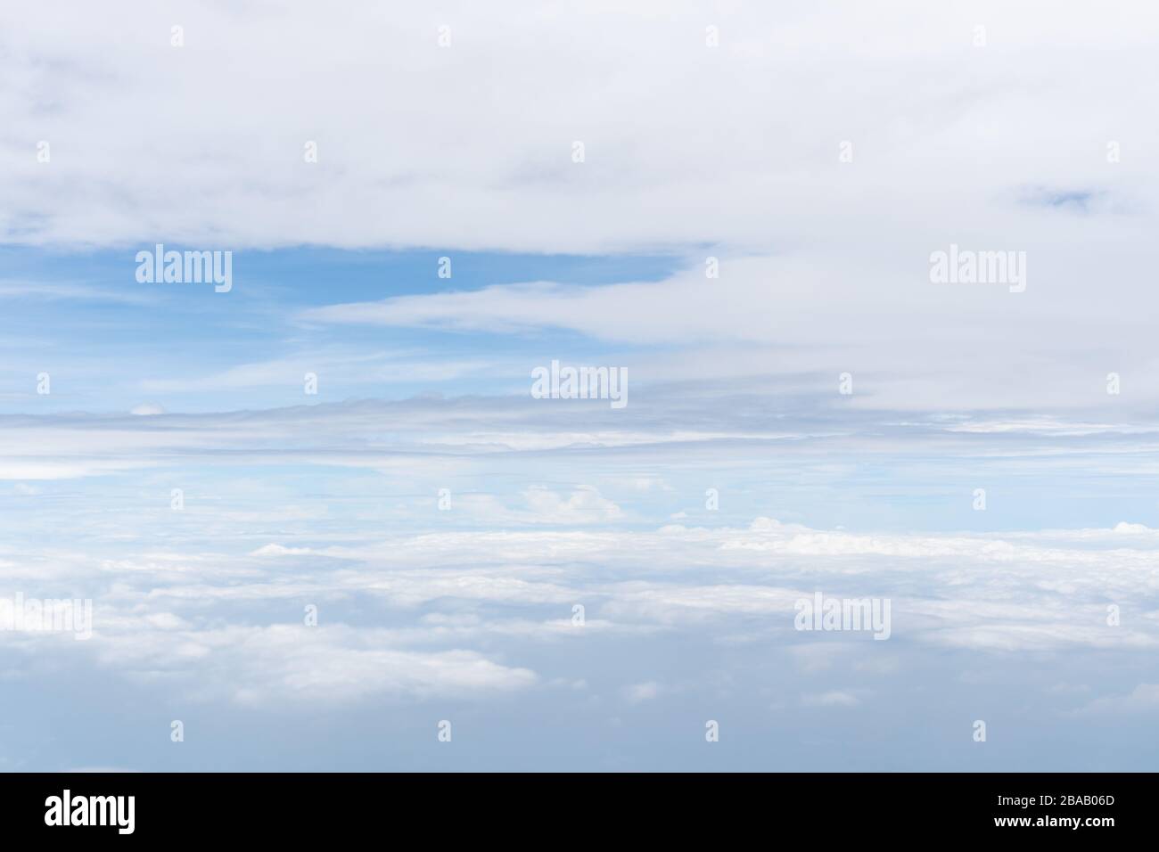Blue sky high view from airplane with lots of clouds Stock Photo - Alamy
