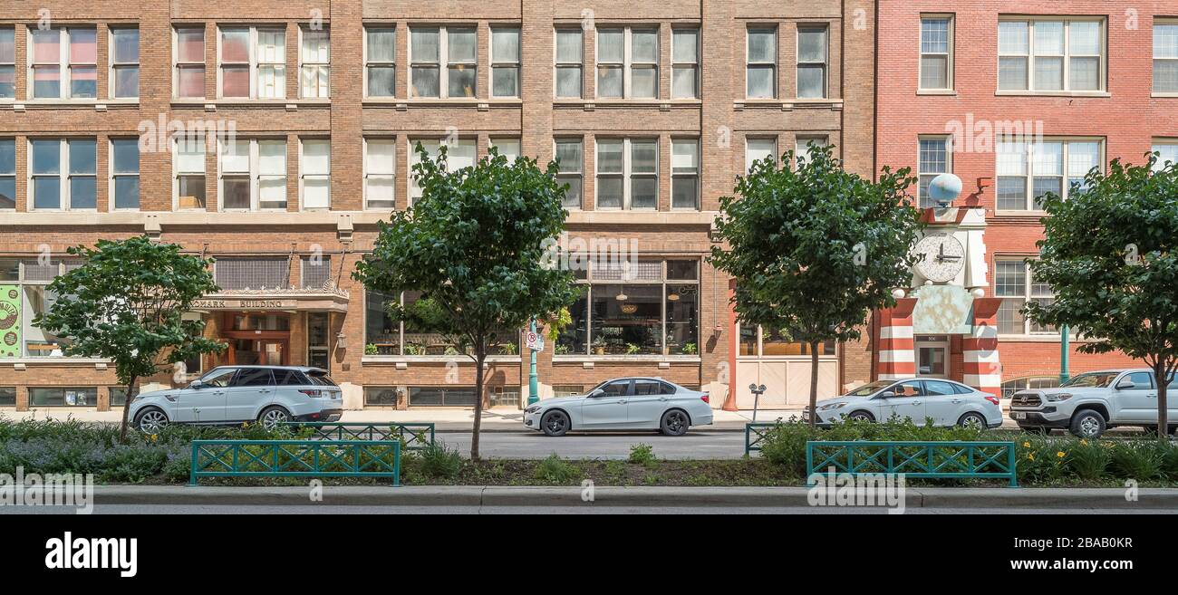 Cars and trees in front of shops and lofts in renovated Third Ward ...
