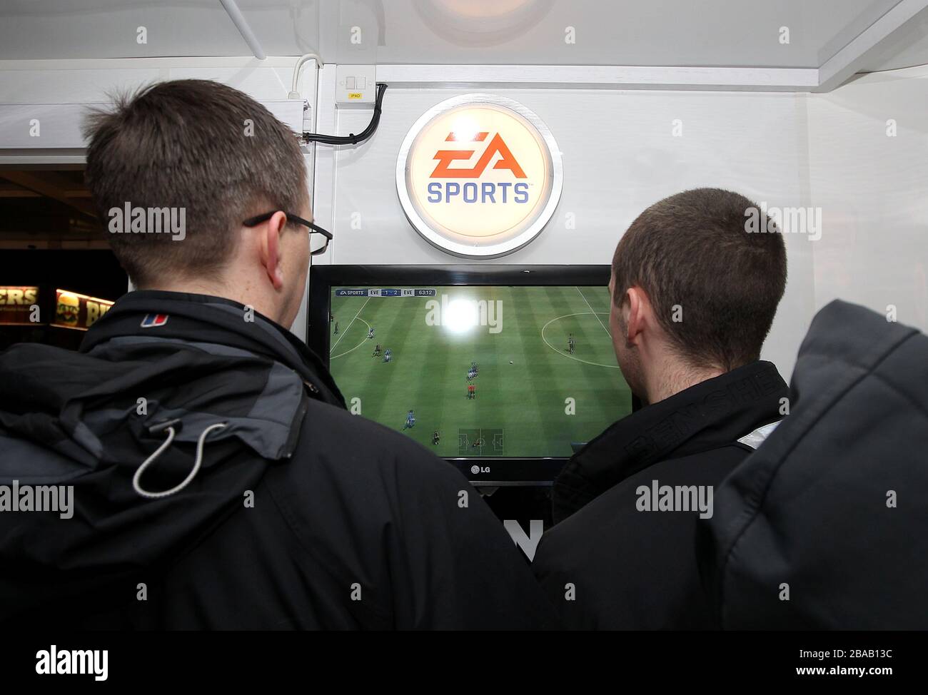 Everton fans play computer games prior to kick-off Stock Photo - Alamy