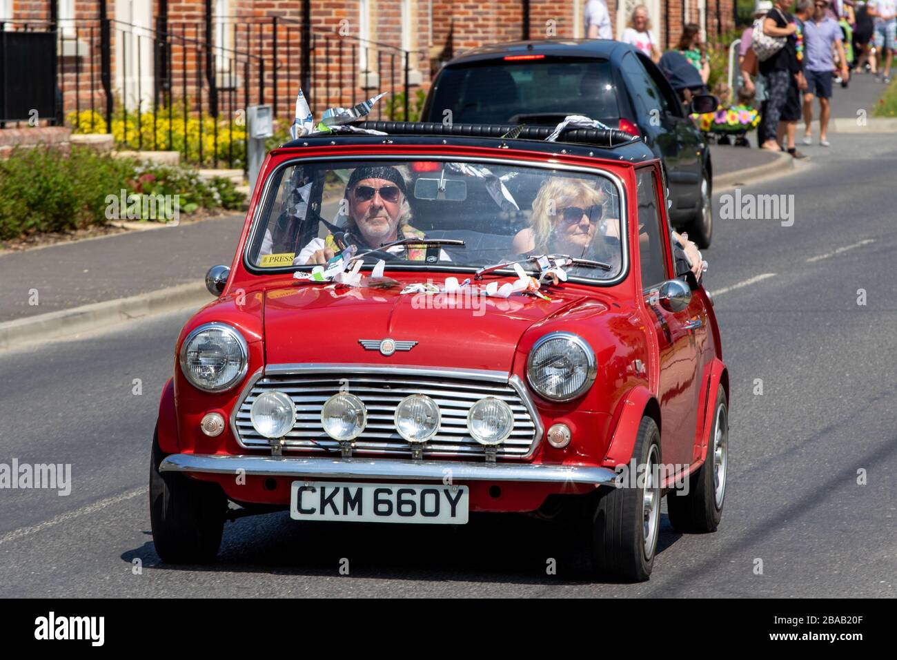 Unusual open top red Mini-Cooper decorated for a parade Stock Photo - Alamy