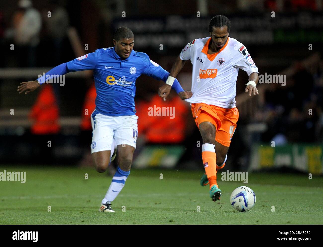 Peterborough United's Mark Little pulls back Blackpool's Nathan ...