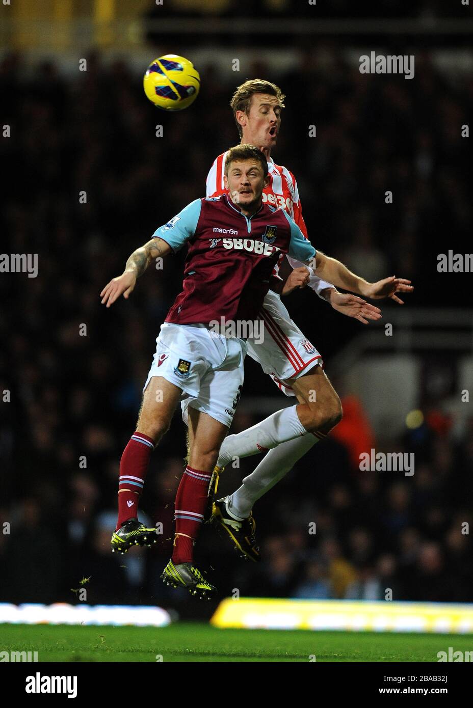 West Ham United's George McCartney and Stoke City's Peter Crouch Stock ...