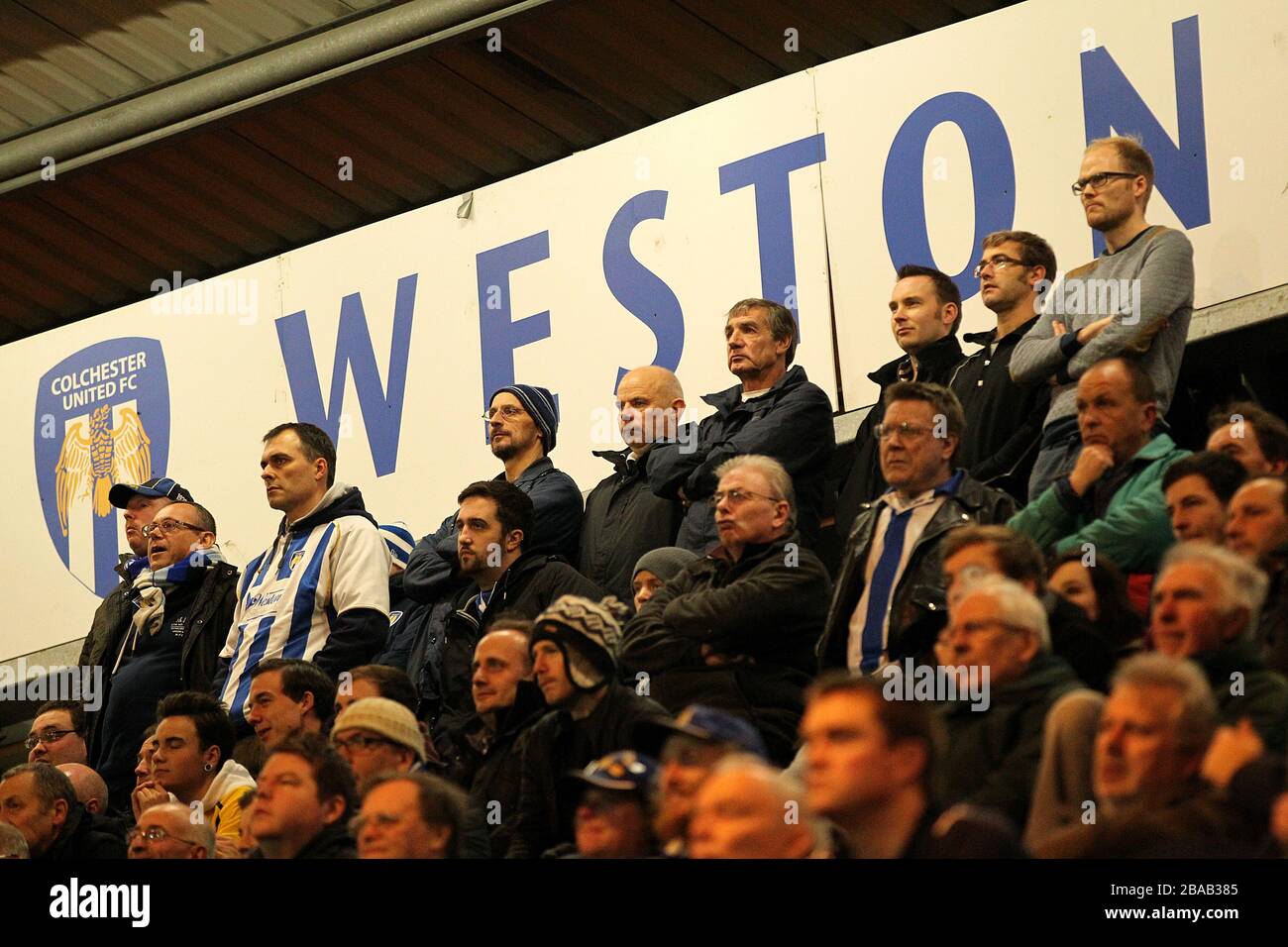 Colchester United fans look on in the stands Stock Photo - Alamy
