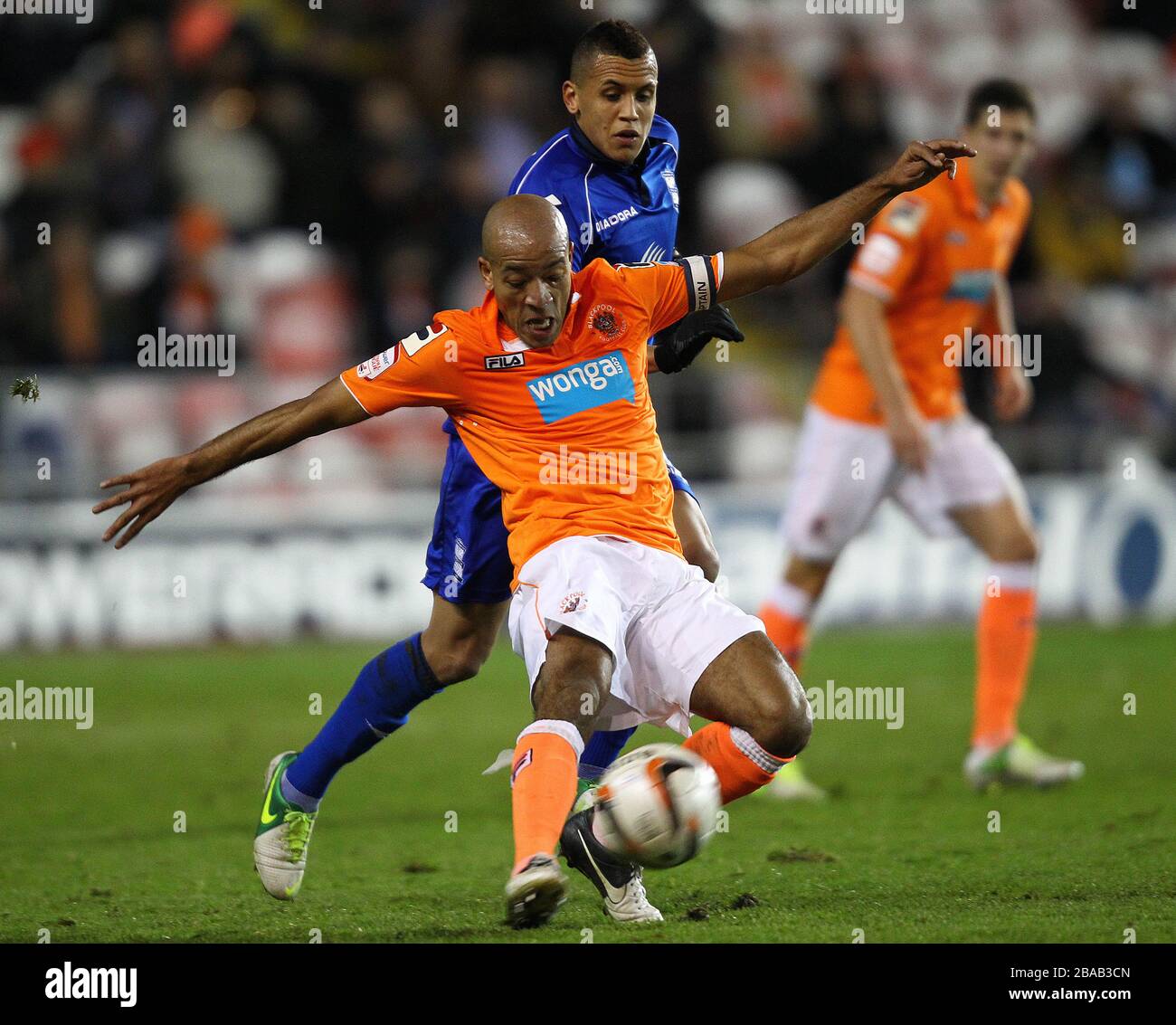 Blackpool's Alex Baptiste (front) and Birmingham's Ravel Morrison Stock ...