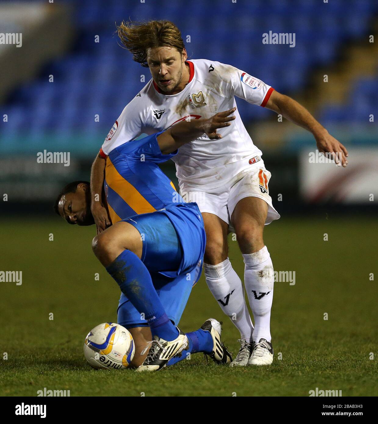 Shrewsbury Town's Julian Bennett and Milton Keynes Dons' Alan Smith ...