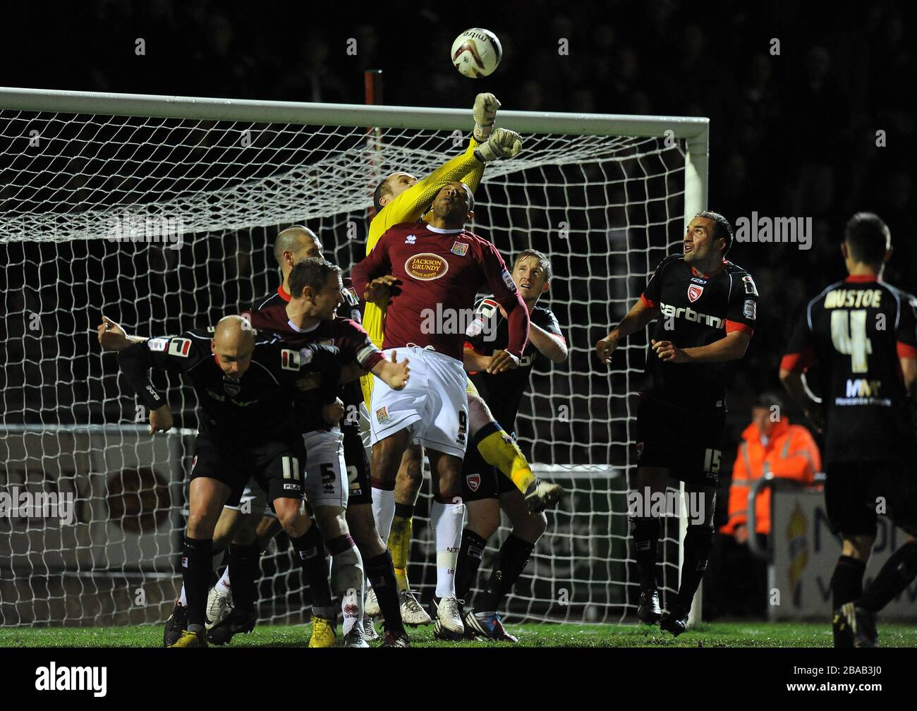 Morecambe's goalkeeper Barry Roche saves from Northampton Town's Clive ...