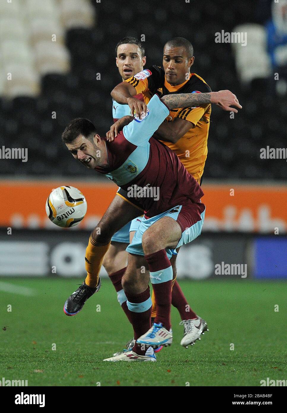 Burnley's David Edgar and Hull City's Jay Simpson battle for the ball ...