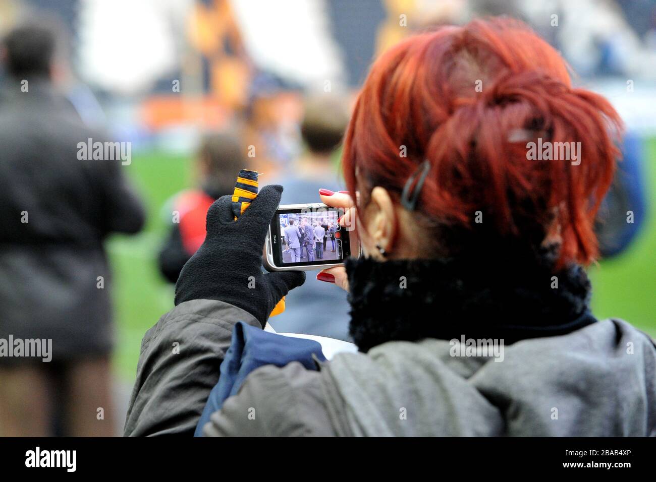 A fan takes photographs on her mobile phone Stock Photo - Alamy