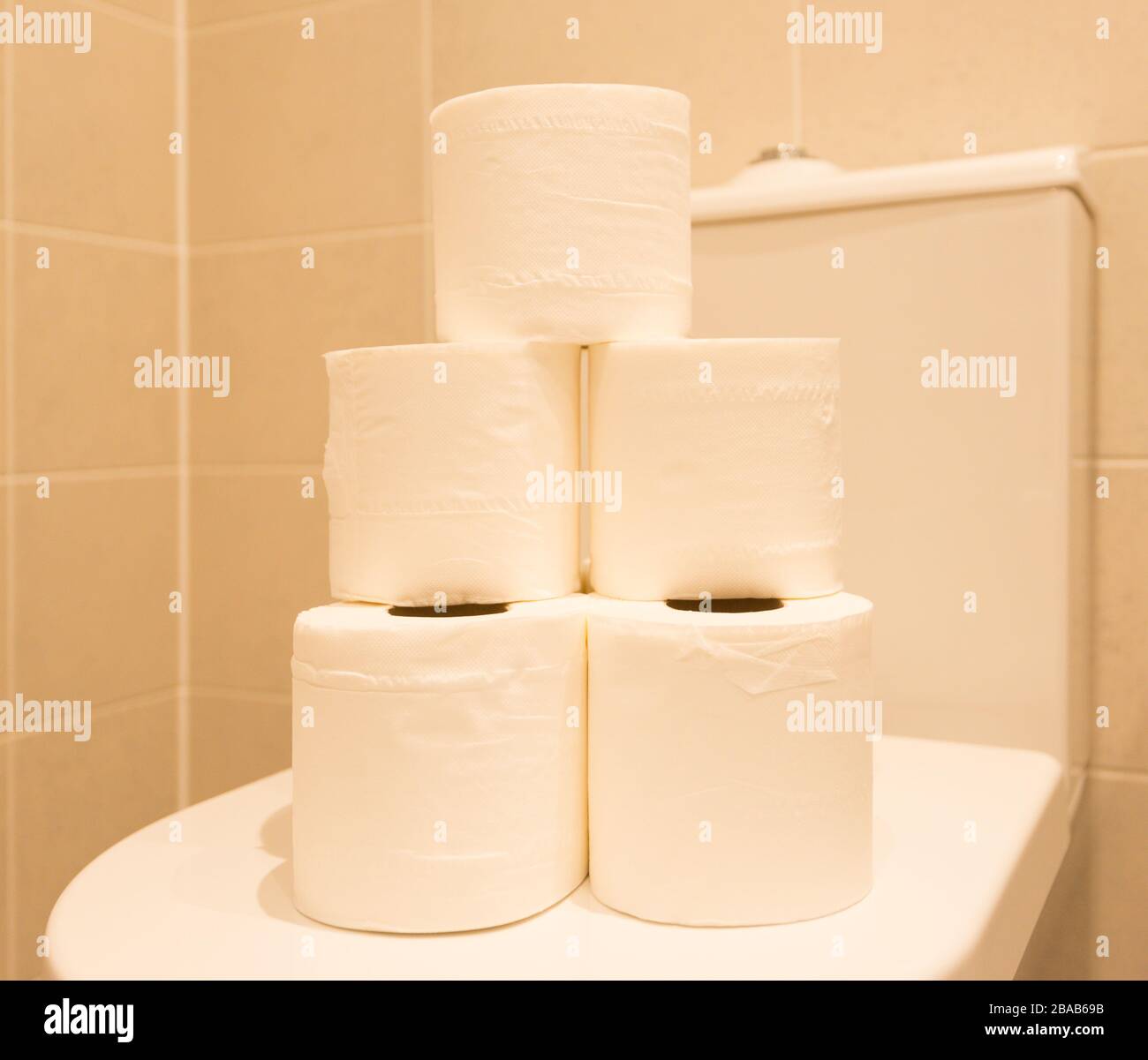 A pyramid of five white toilet rolls in very short supply across the UK ...