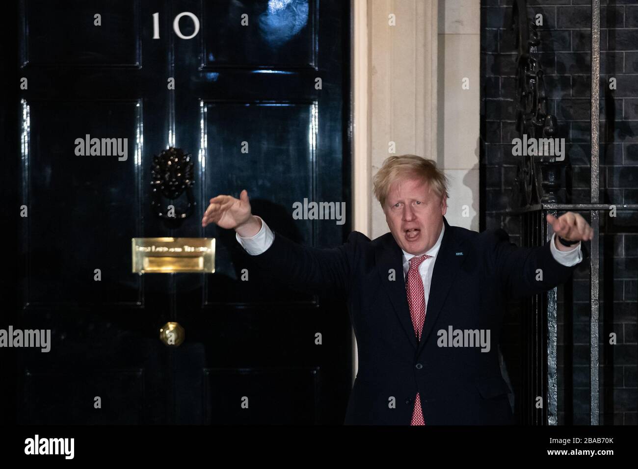 Prime Minister Boris Johnson outside 10 Downing Street, London, joining ...