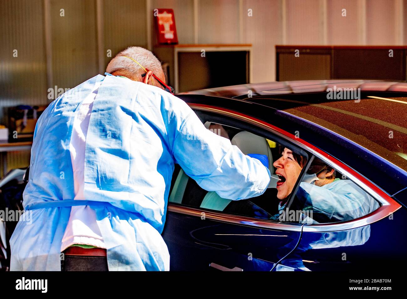 A female passenger seen being tested for COVID-19 Coronavirus at a ...