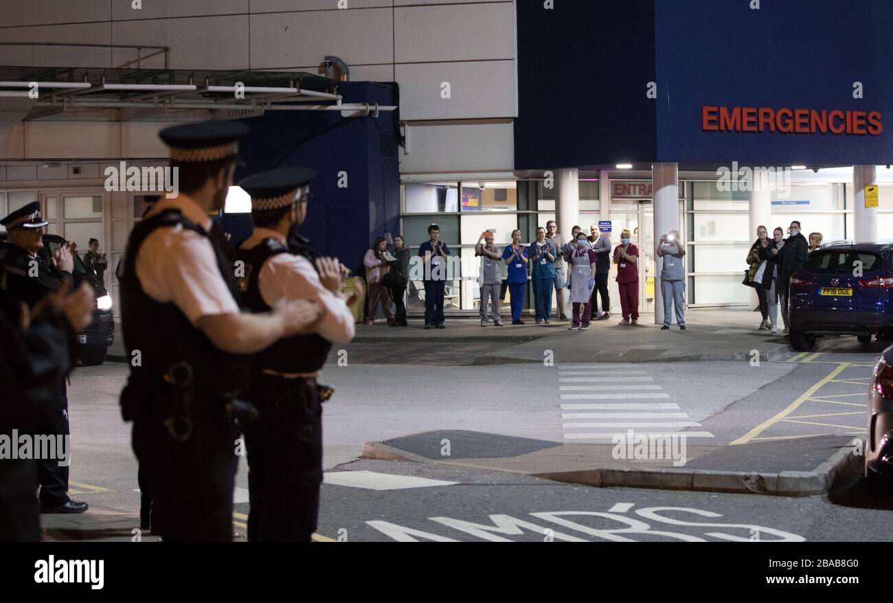Police and staff from the Royal Liverpool University Hospital join in a ...