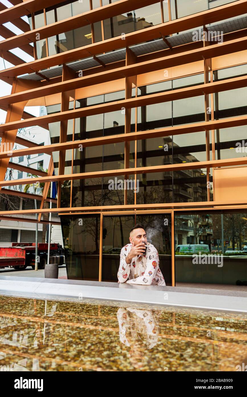 Handsome stylish young man smoking outside in a break time Stock Photo ...