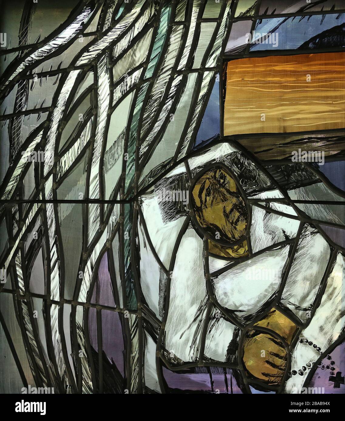 Simon of Cyrene carries the cross, detail of stained glass window by ...