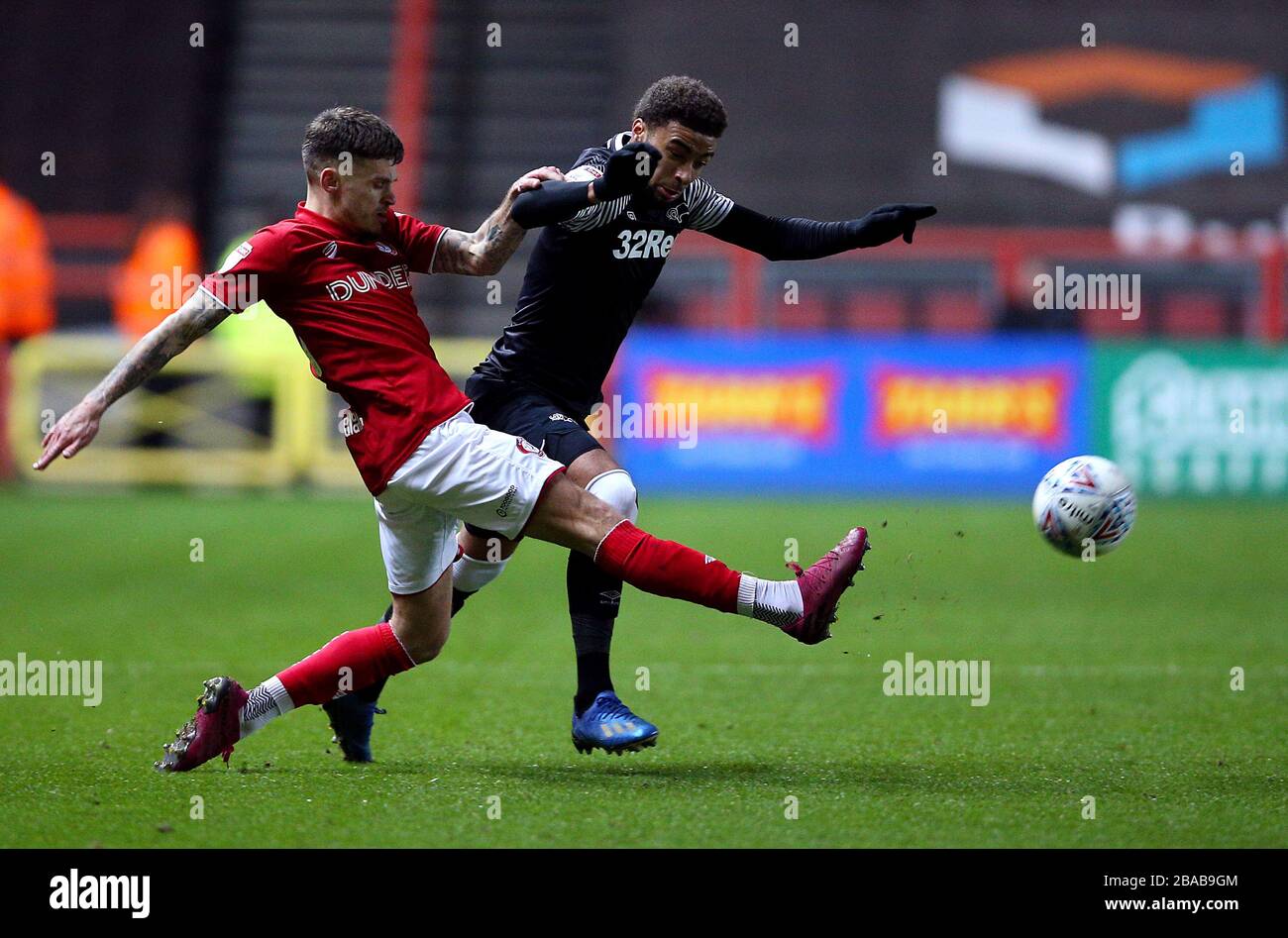 Bristol City's Jamie Paterson (left) and Derby County's Jayden Bogle ...