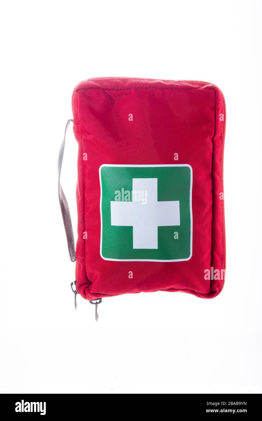 Red medical kit. Compact mobile first aid kit Stock Photo - Alamy