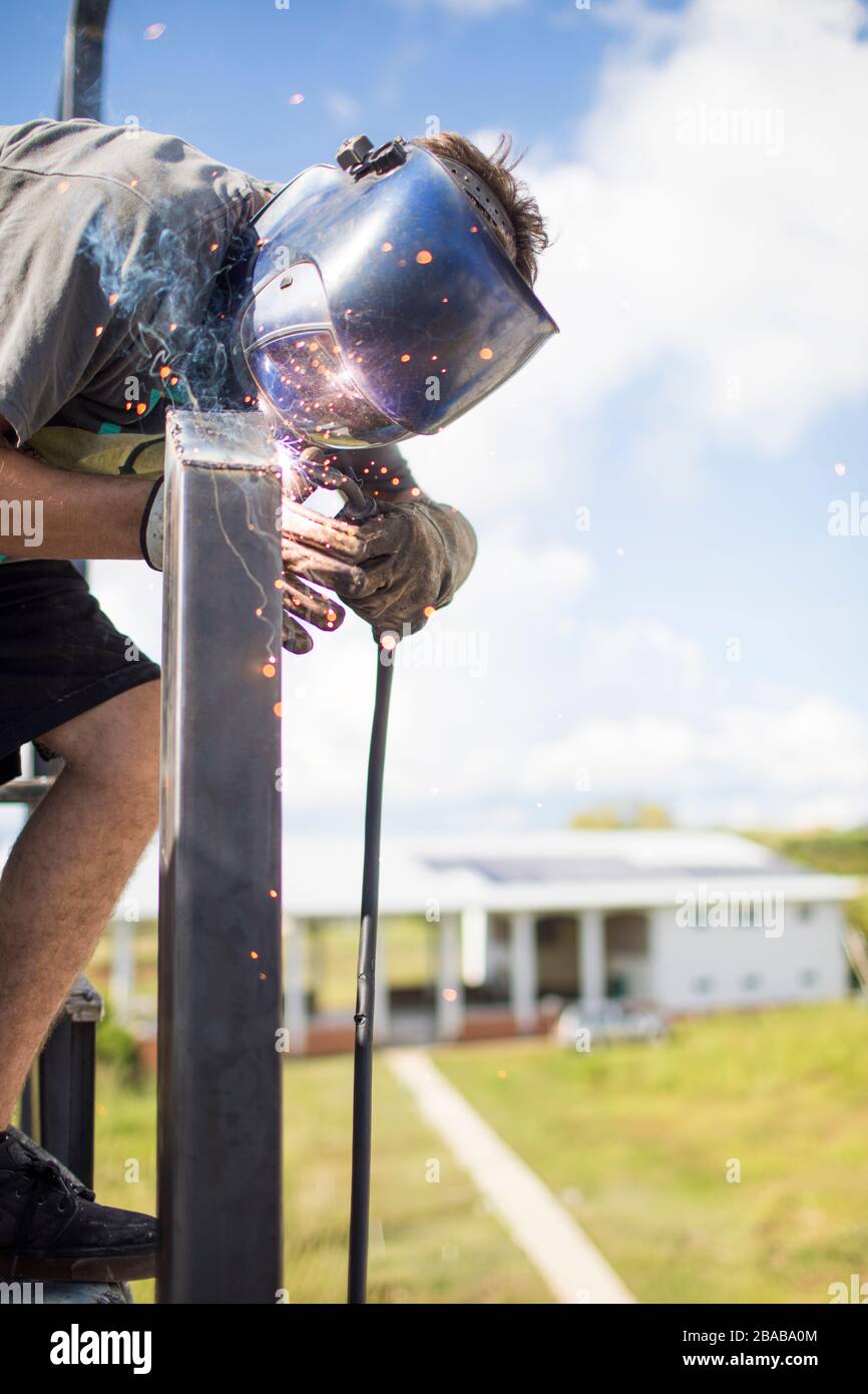 close up view of man welding outdoors on rooftop Stock Photo - Alamy