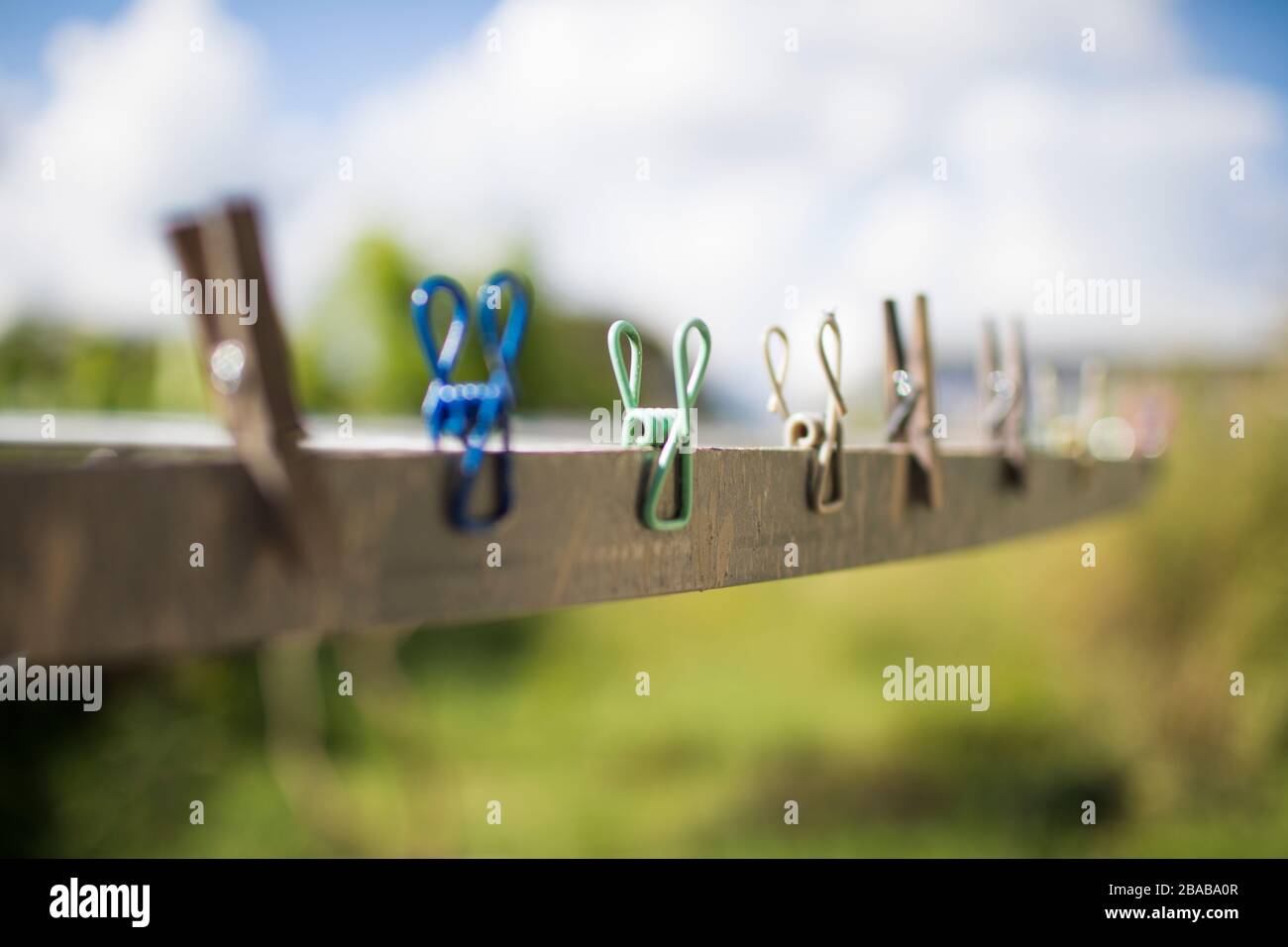 Clothes pegs on a clothing line Stock Photo - Alamy