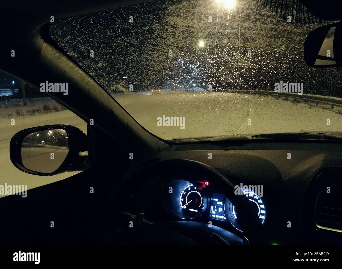 Safety driving. Car with frozen windshield stopped on roadside in the ...