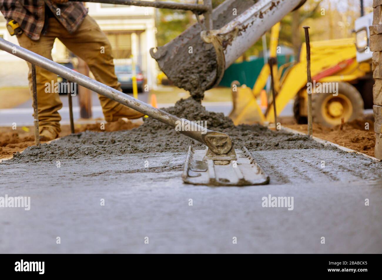 Worker working for concrete pavement for ground at construction Stock ...