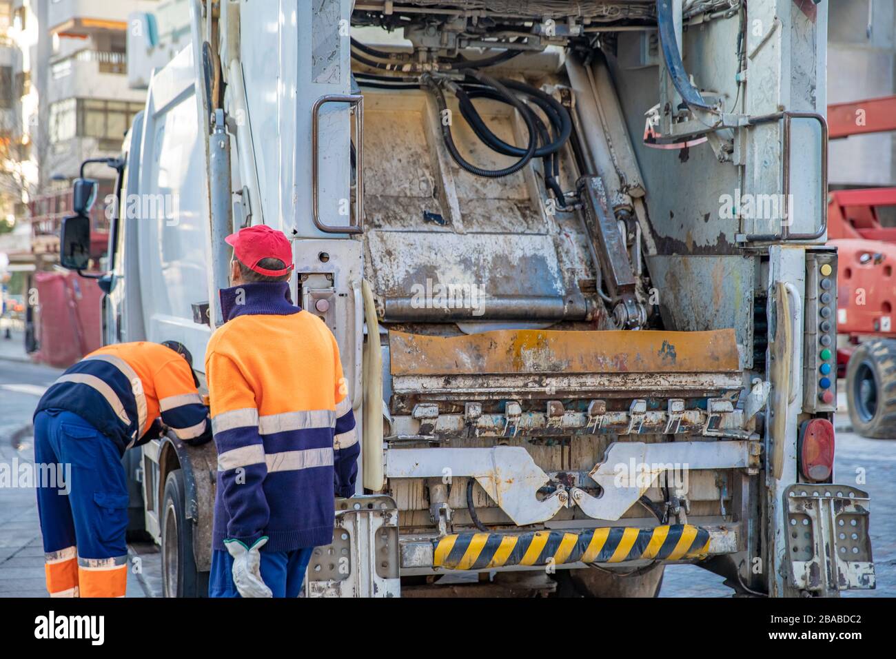 collecting waste from a container by a special car in the streets of a ...