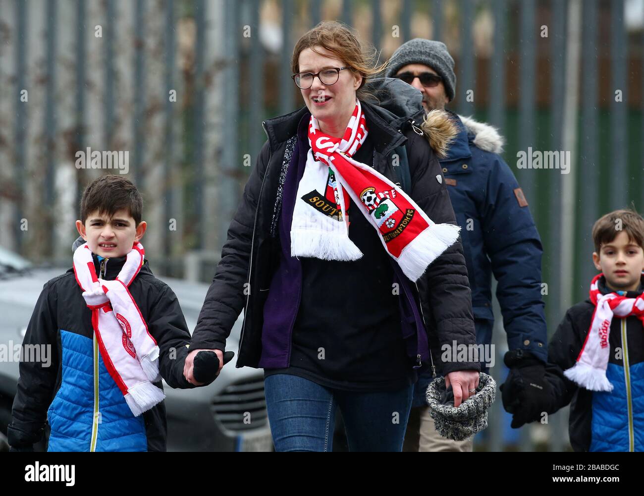 Southampton fans arriving in the rain before the game Stock Photo - Alamy