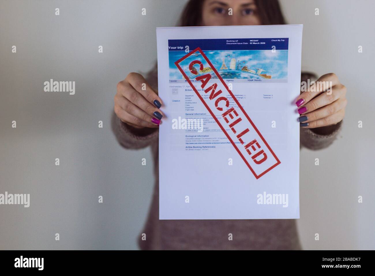 Cancelled Flight Compensation. Cancelled flights. Young woman holding ...