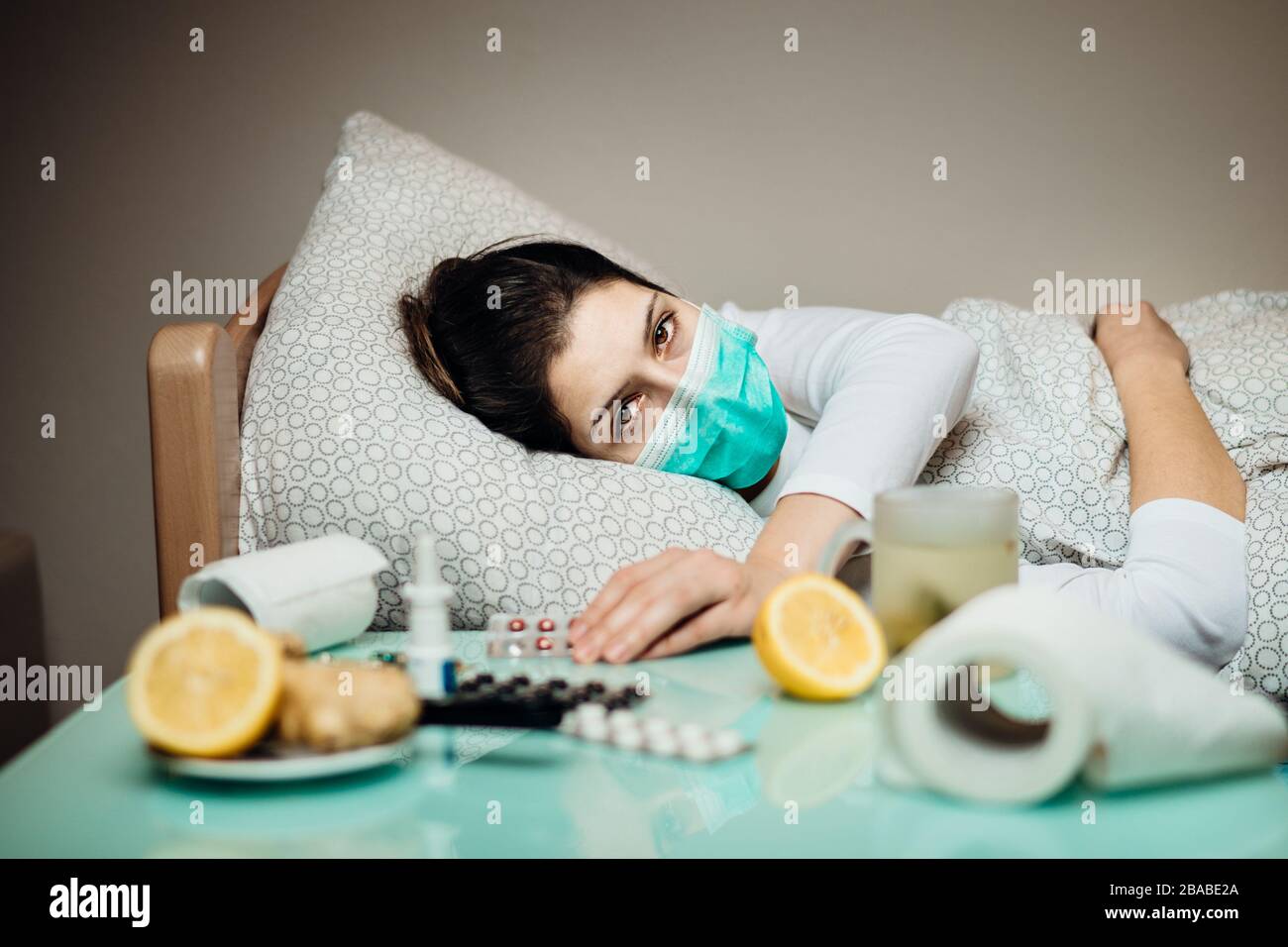 Sick woman in home quarantine bed self-isolation.Severe pneumonia ...