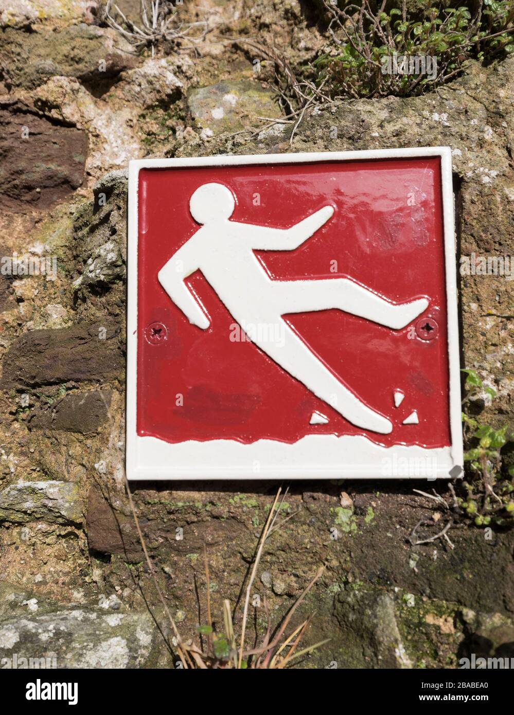 Danger of slipping and tripping sign, Raglan Castle, Wales, UK Stock ...