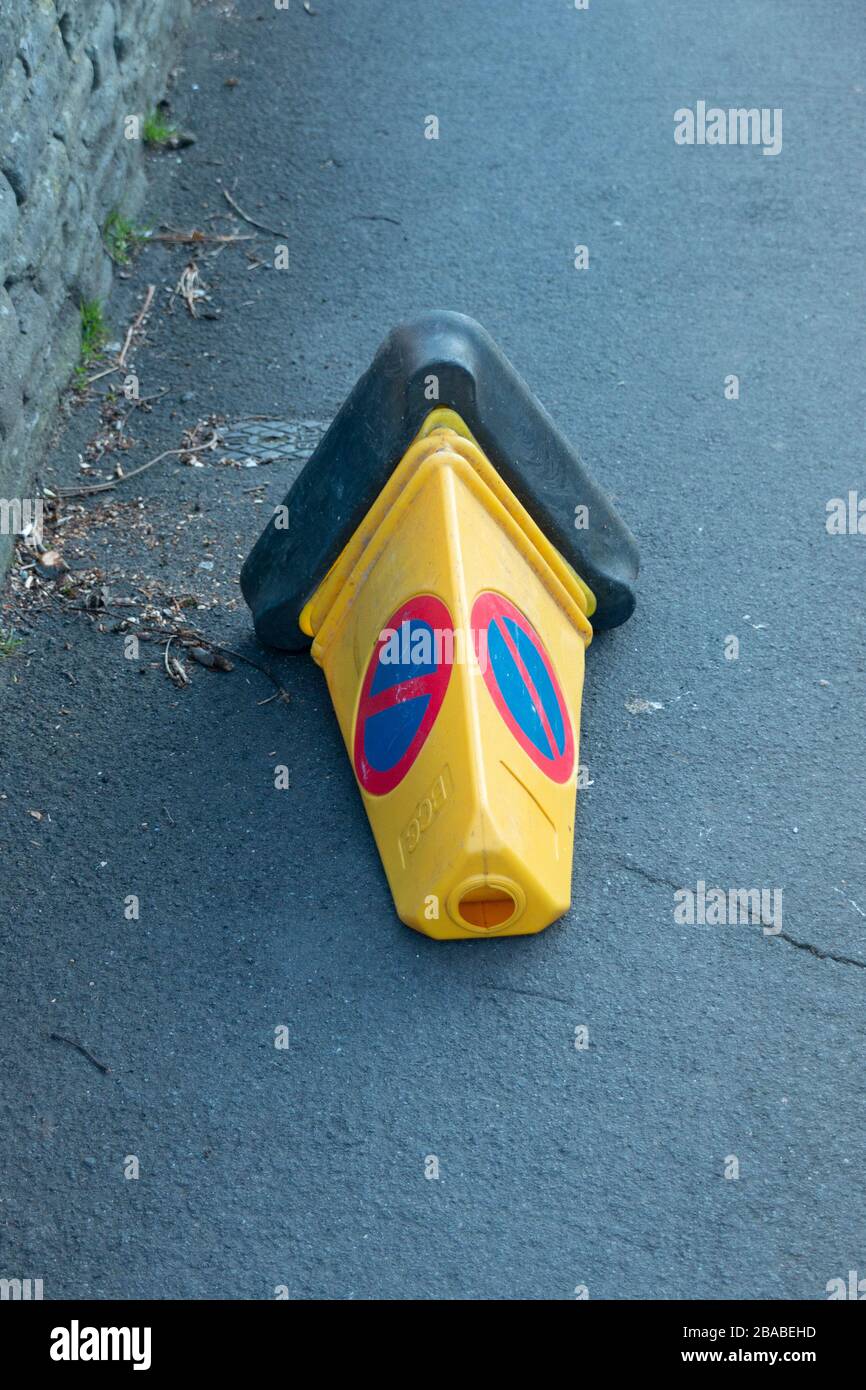 a close up view of a no entry cone that has fallen over on the side of ...