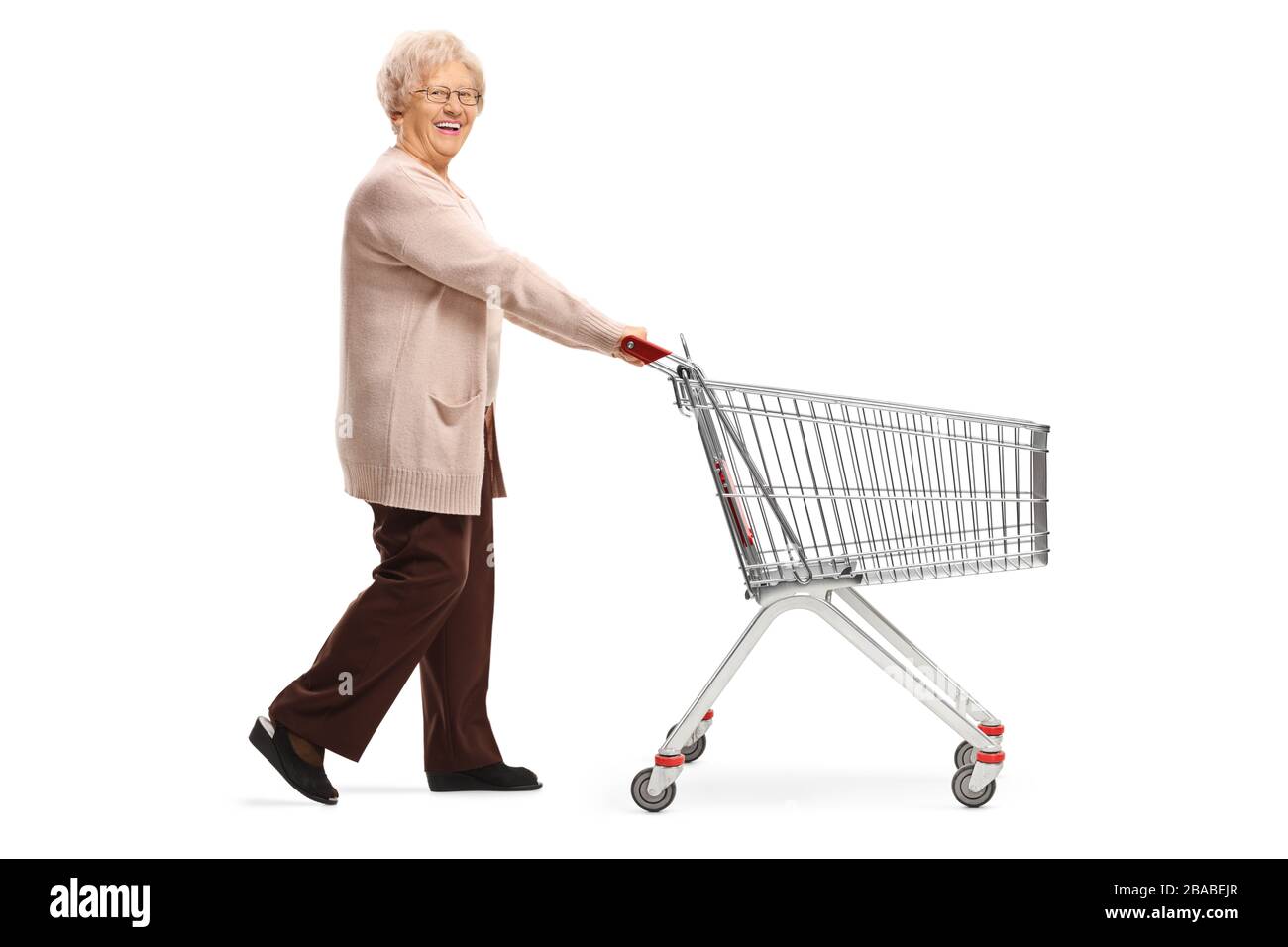 Full length shot of a senior woman pushing an empty shopping cart ...