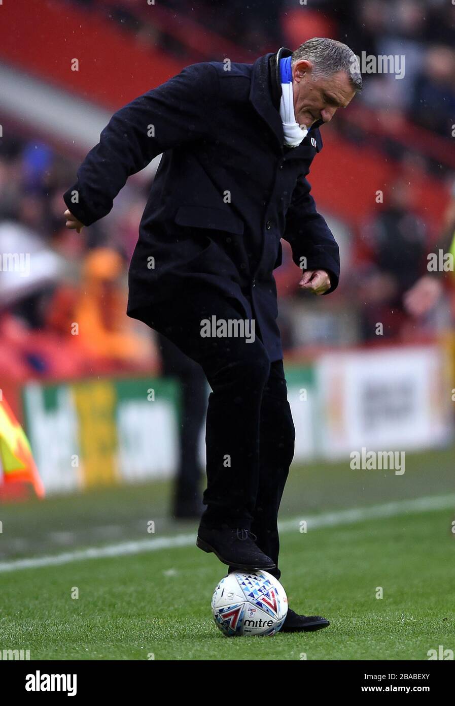Blackburn Rovers manager Tony Mowbray controls the ball on the pitch ...