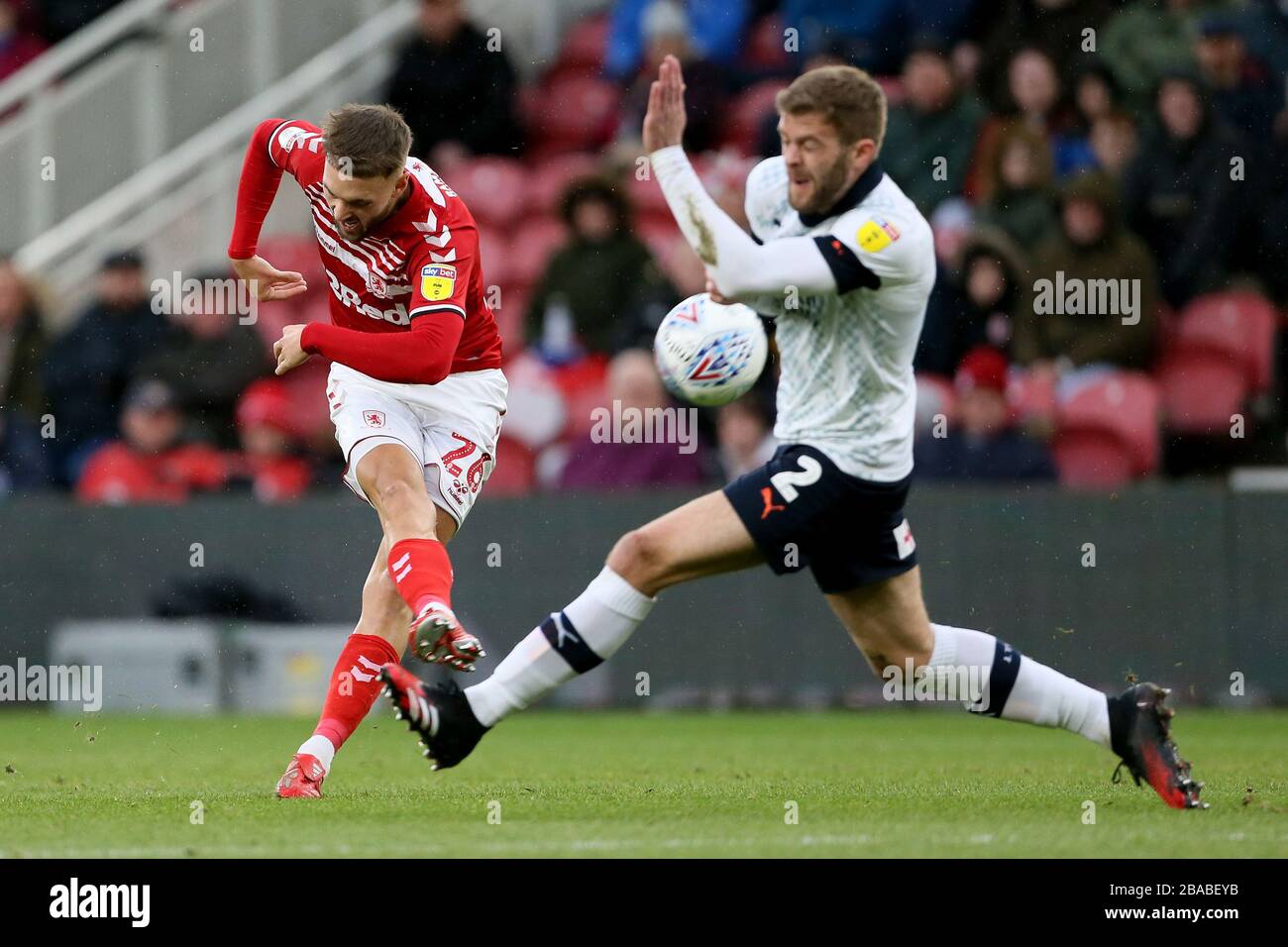 Middlesbrough's Lewis Wing (left) shoots towards goal Stock Photo - Alamy