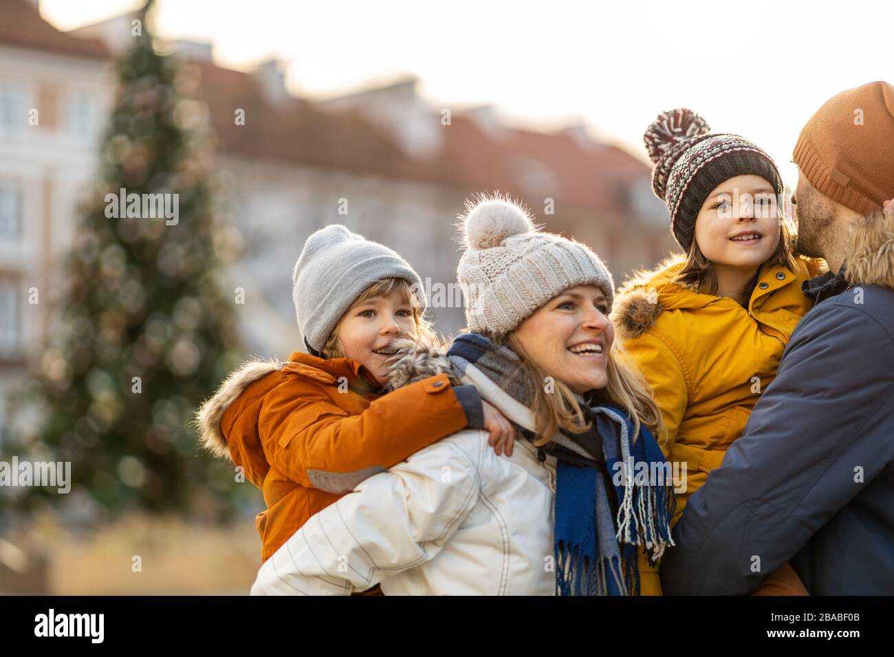 Affectionate young family enjoying their day in a city Stock Photo - Alamy