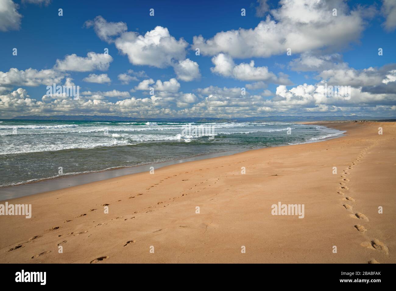 Scenic seascape. Tranquility scene of empty sand beach with footprints ...