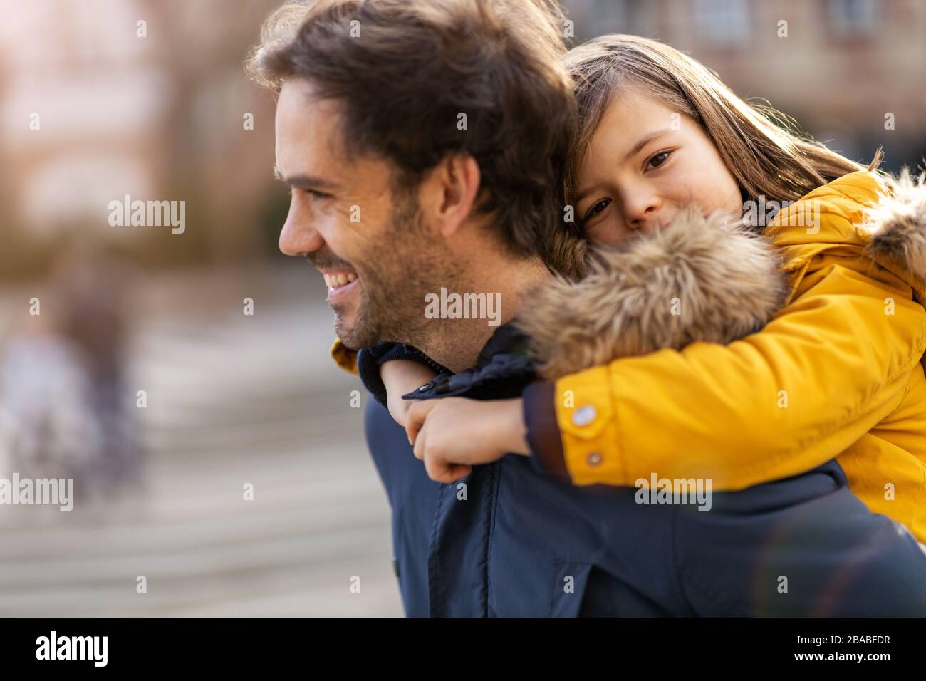 Dad and little son hugging outdoors Stock Photo - Alamy