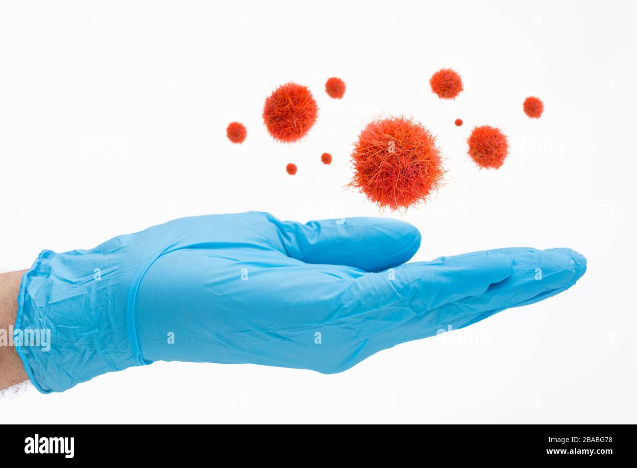 Gloved hand with virus Stock Photo - Alamy